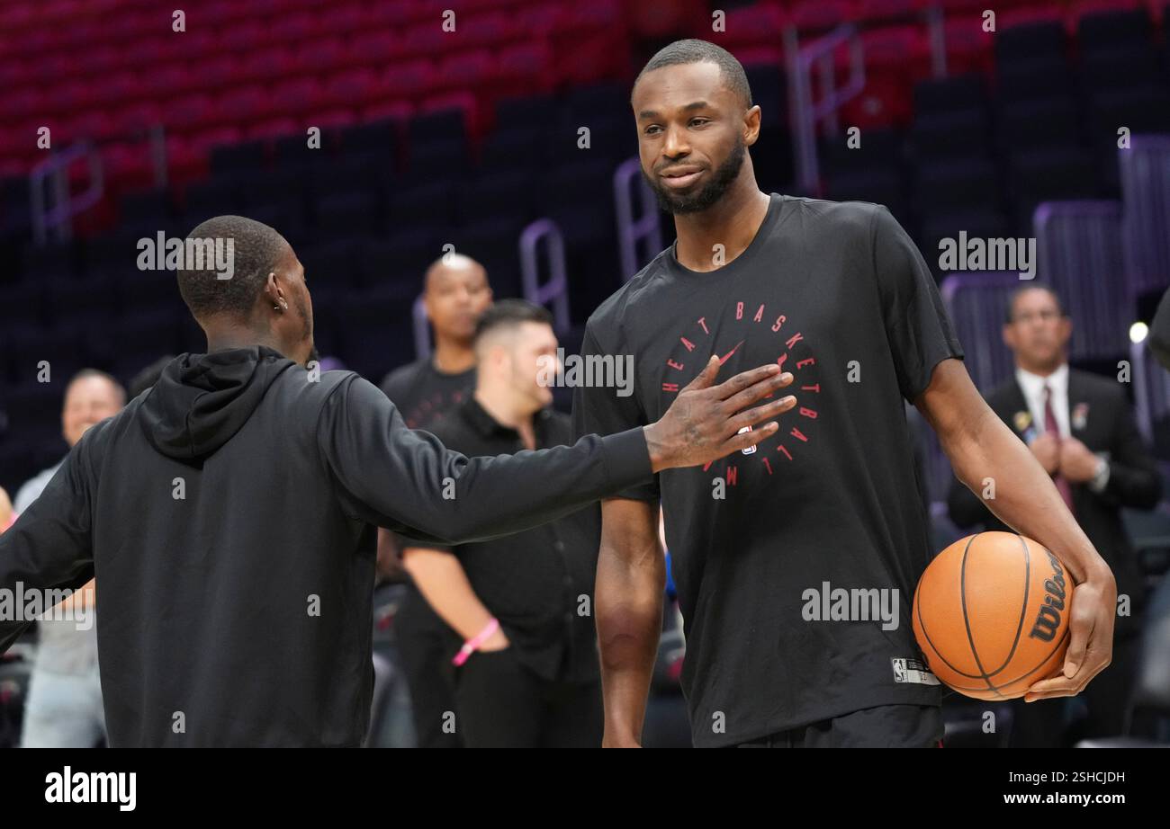 Miami Heat forward Andrew Wiggins, right, is greeted as he warms up ...
