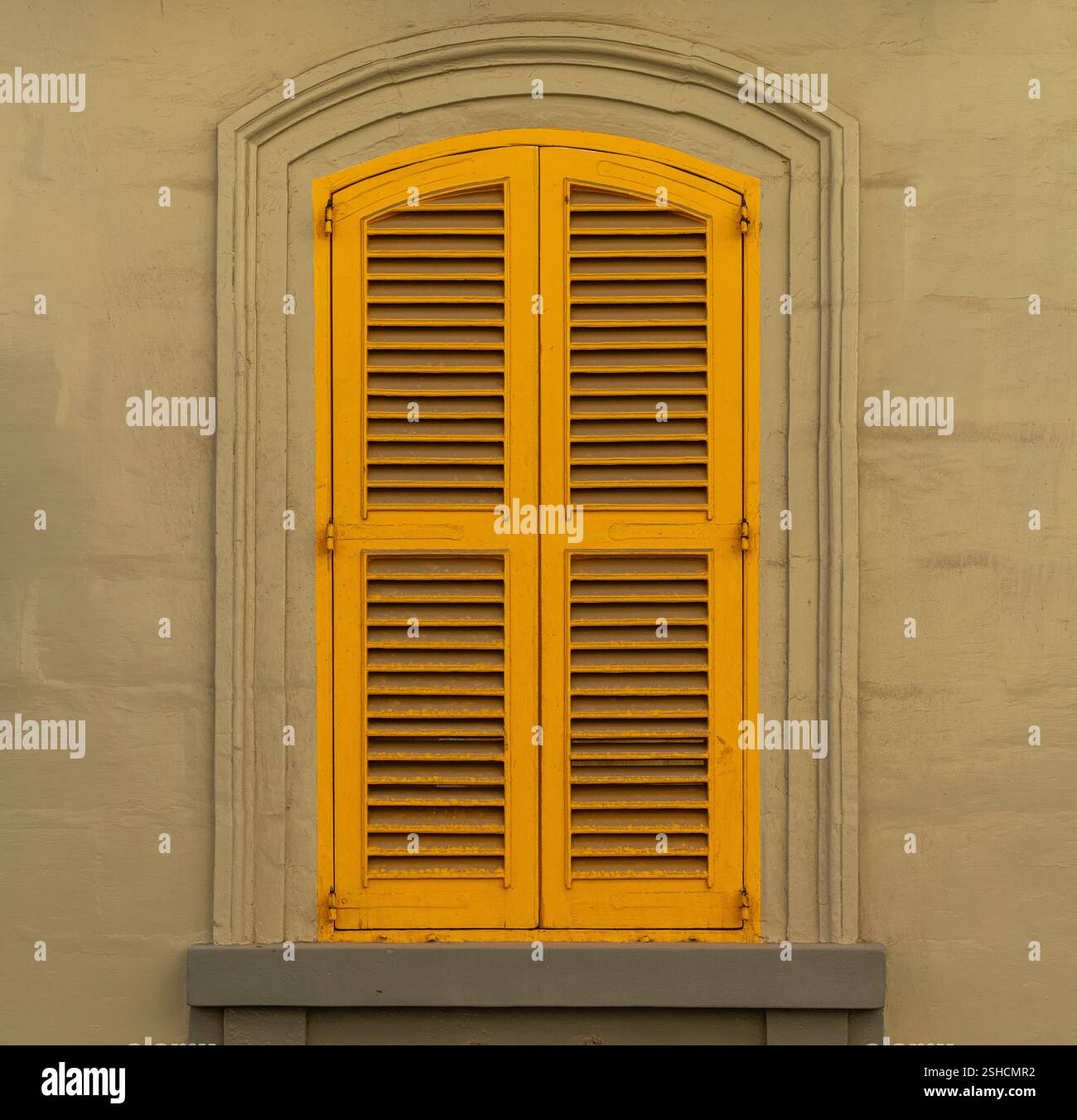 Traditional house detail in Malta. Limestone yellow bricks and colorful ...