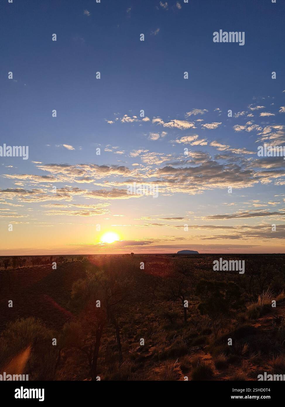 Uluru at sunrise Stock Photo - Alamy