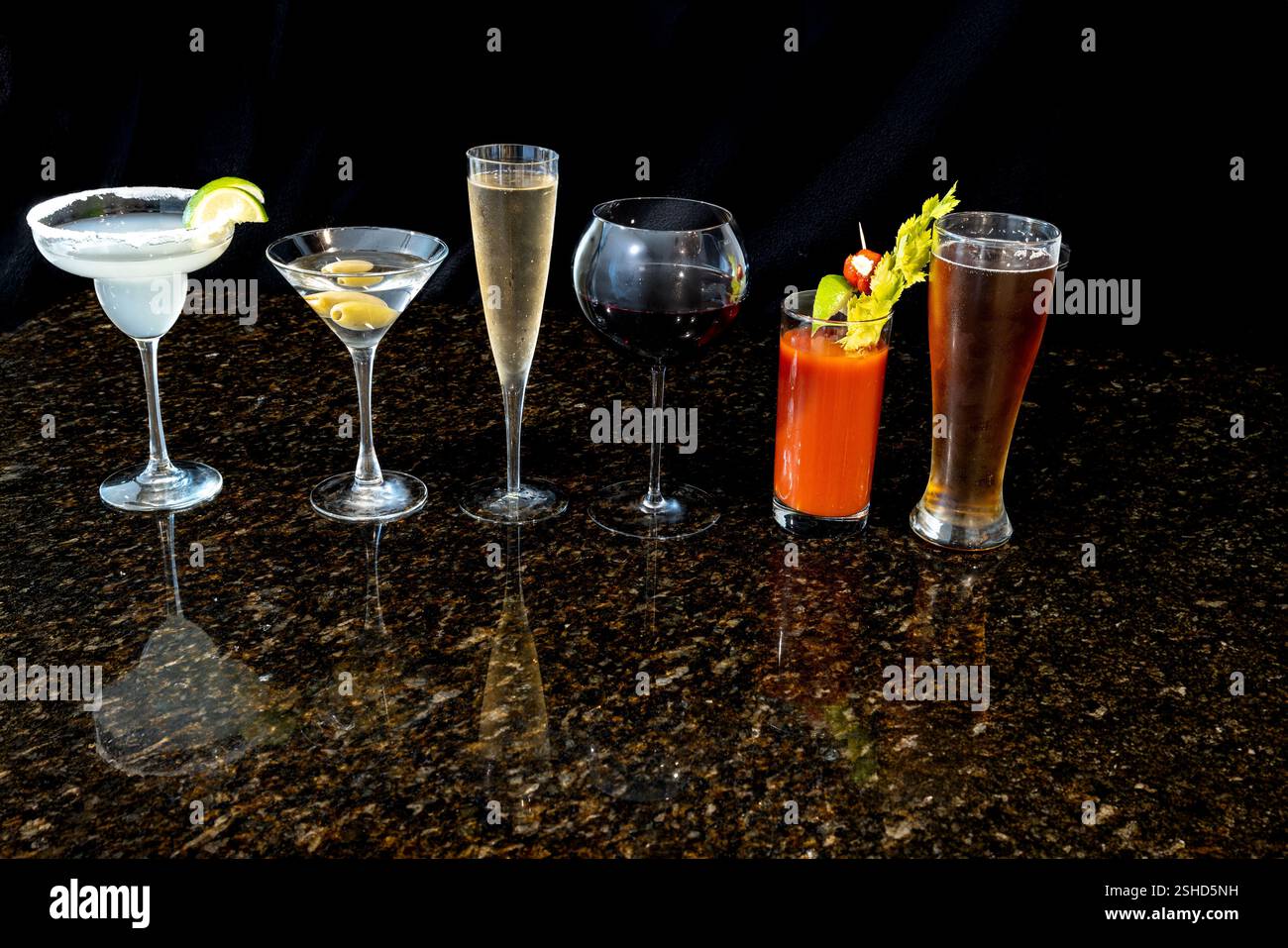 Large group of cocktails including a margarita, martini, champagne ...