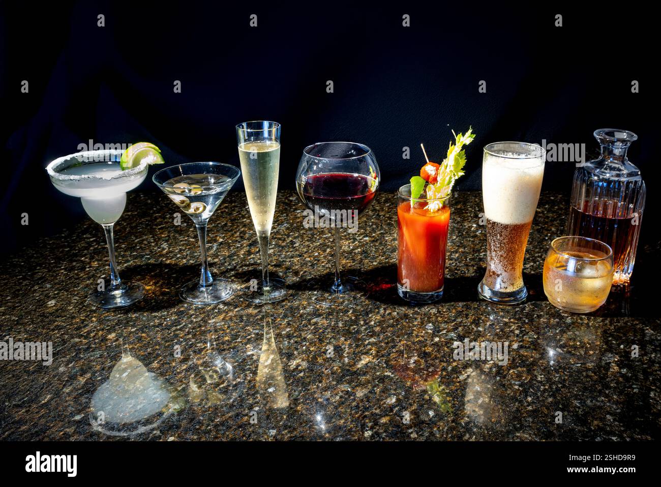 Large group of cocktails including a margarita, martini, champagne ...