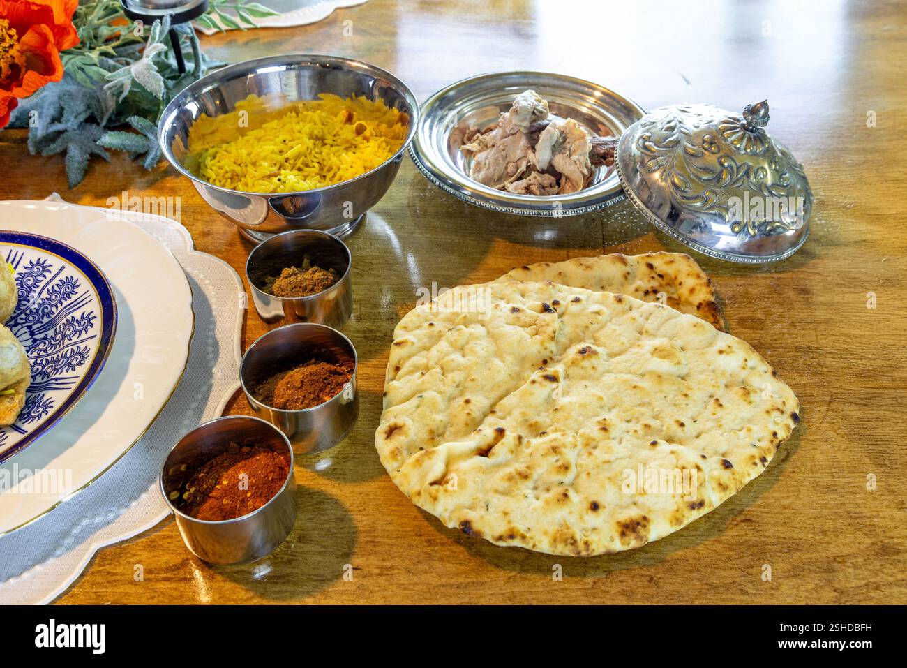Samosas with various spices, saffron rice, naan bread and duck meat at ...