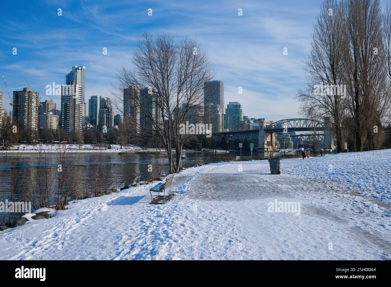 Pathway in Vanier Park alongside English Bay with the Burrard Bridge in ...