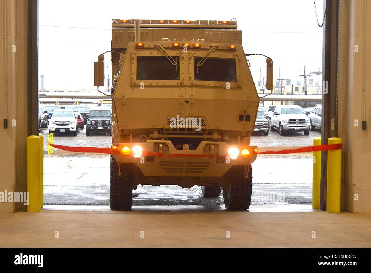 A Family of Medium Tactical Vehicle (FMTV) makes it way through a ...