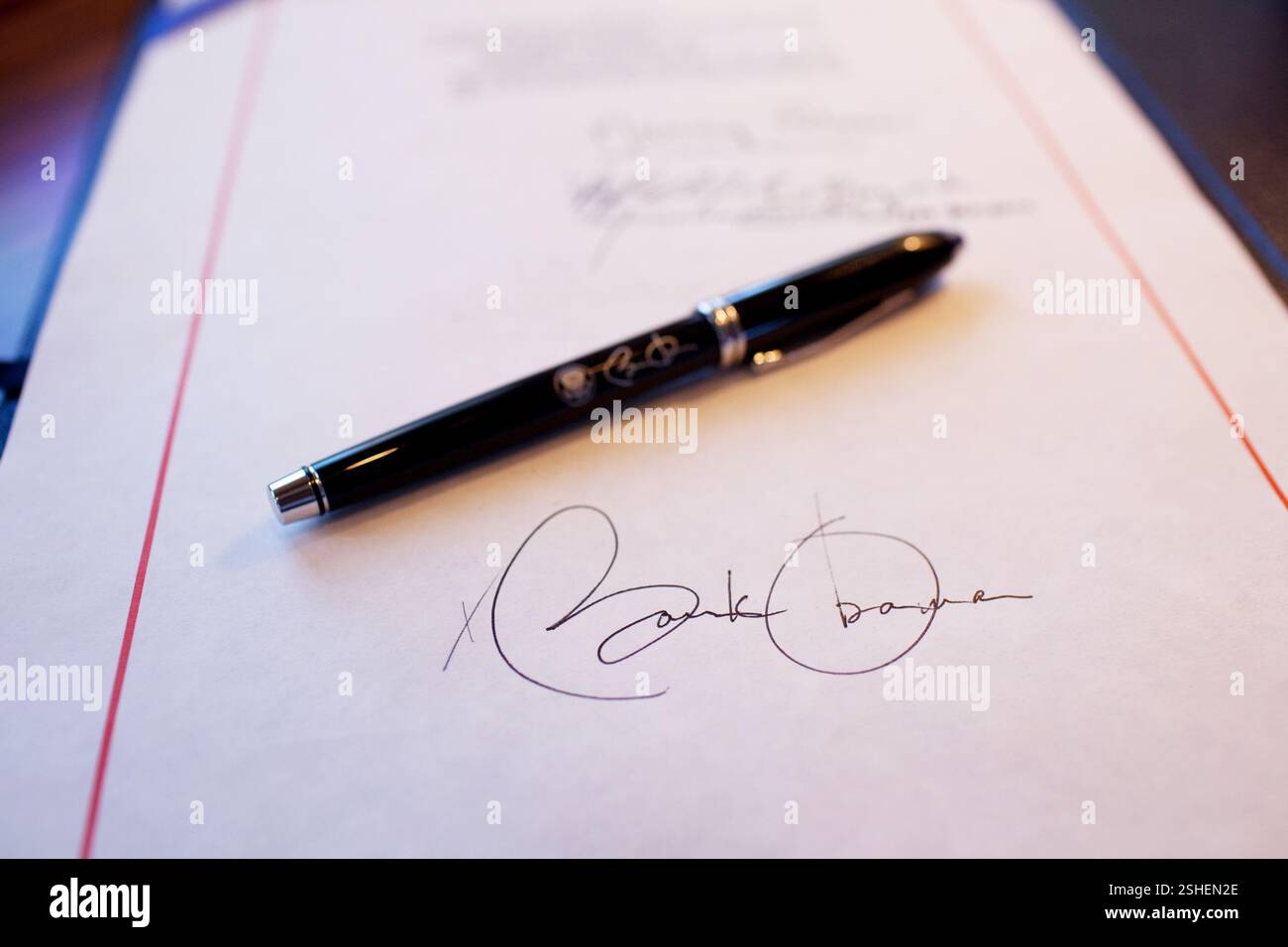 Close-up detail of President Obama's signature on a bill, and a pen ...