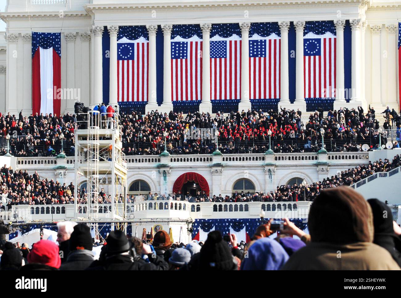 A crowd of well-wishers watch as President Barack Obama takes the oath ...