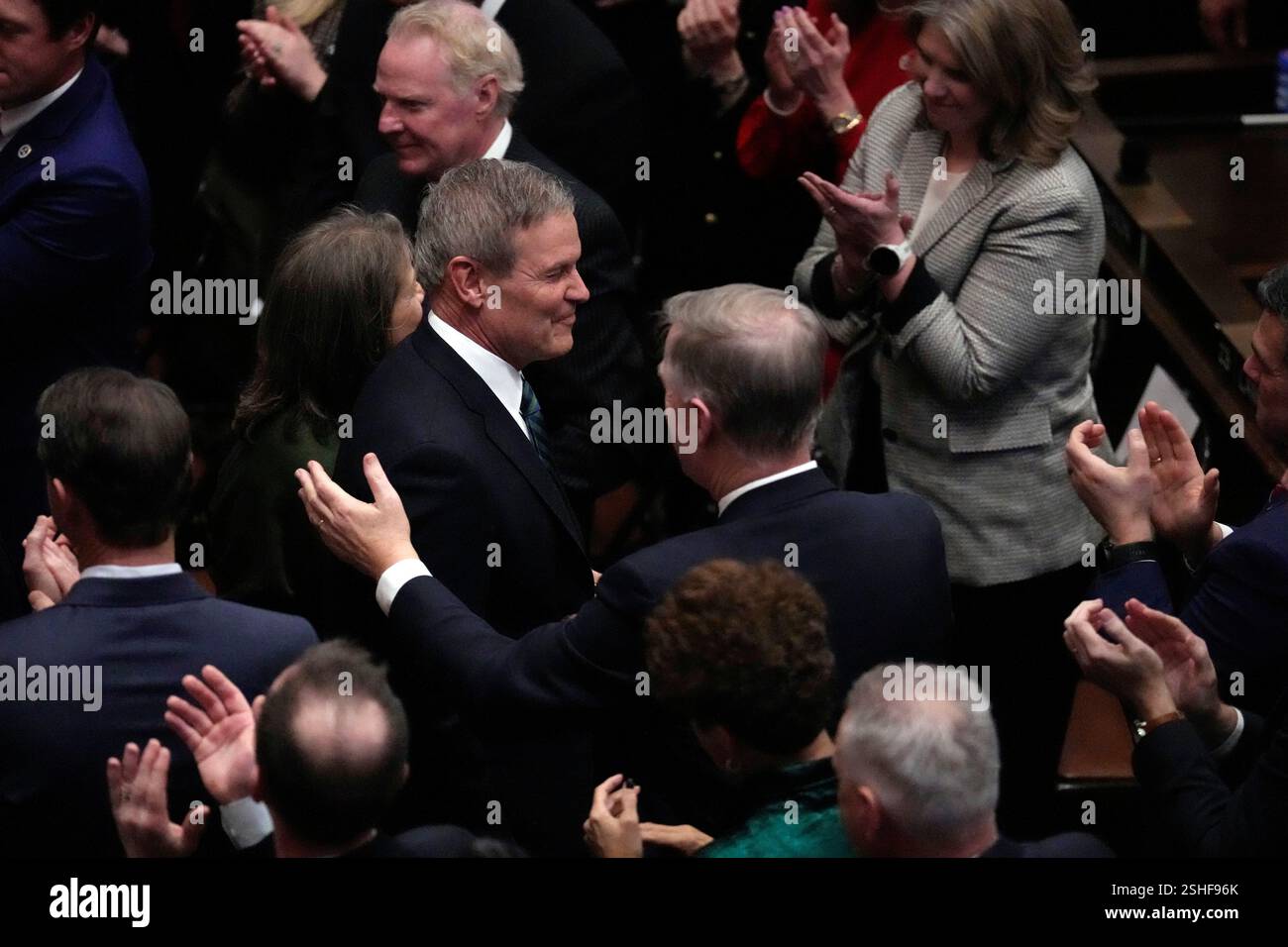Governor Bill Lee, center, leaves the House chamber after he delivered ...