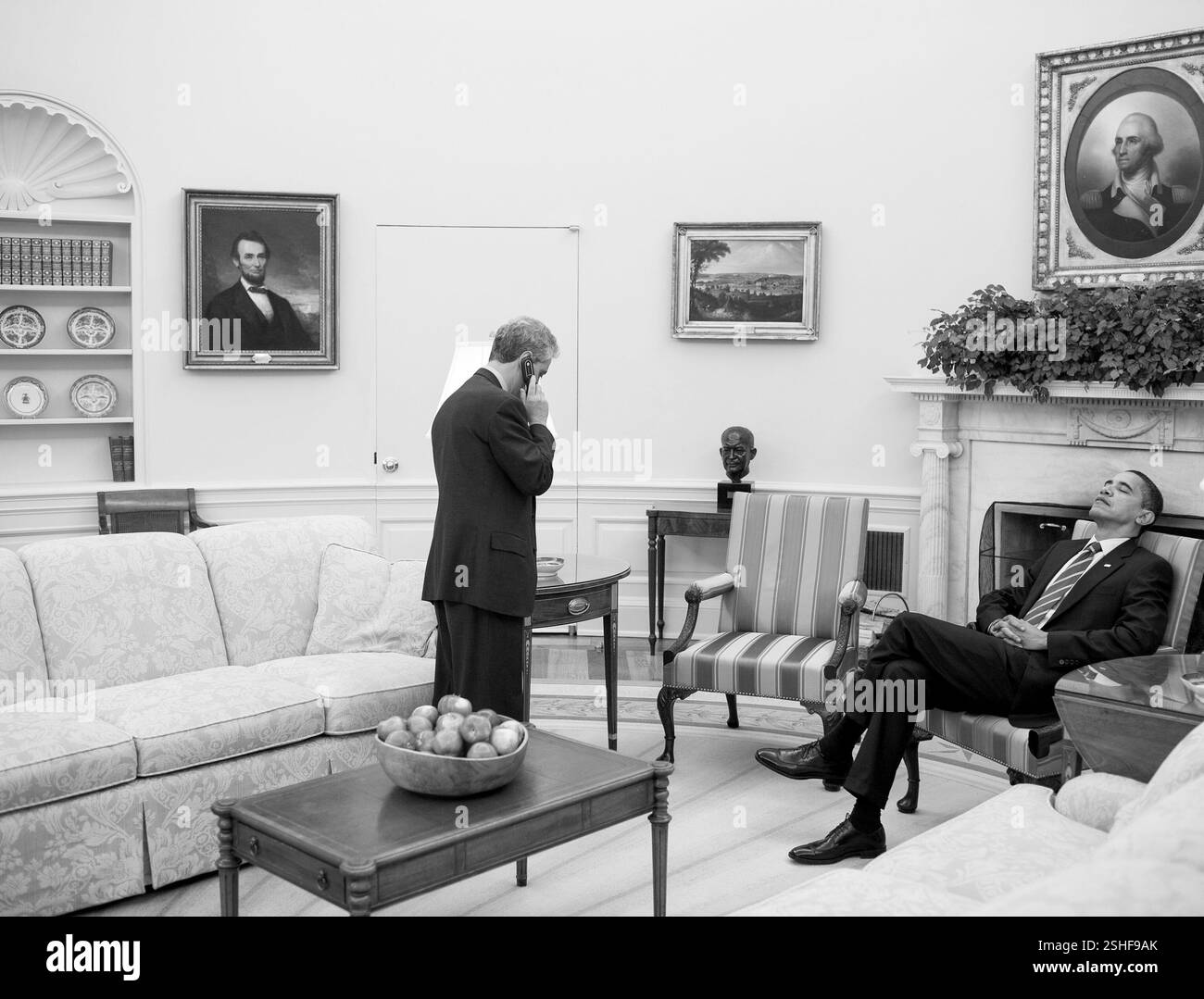 President Barack Obama rests his head on his chair while Chief of Staff ...