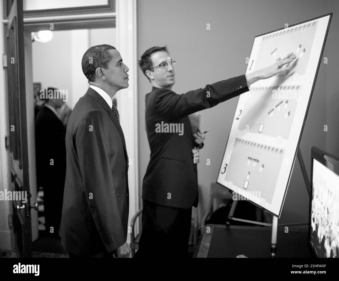 President Barack Obama is briefed before the Swearing-in Ceremony for ...