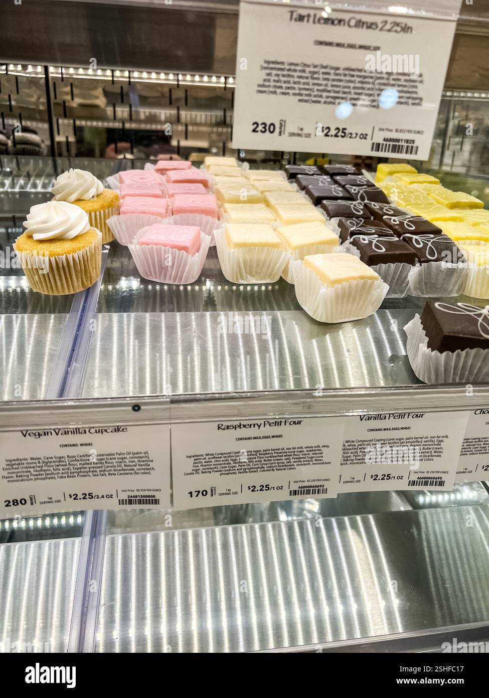 Assorted petit fours and cupcakes display Stock Photo - Alamy