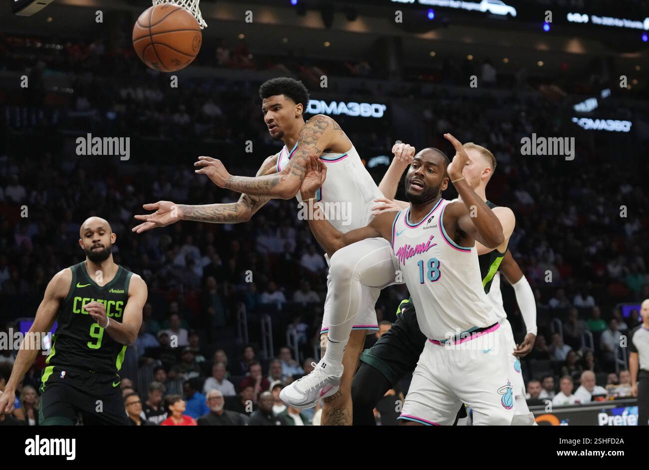 Miami Heat center Kel'el Ware, second from left, and guard Alec Burks ...