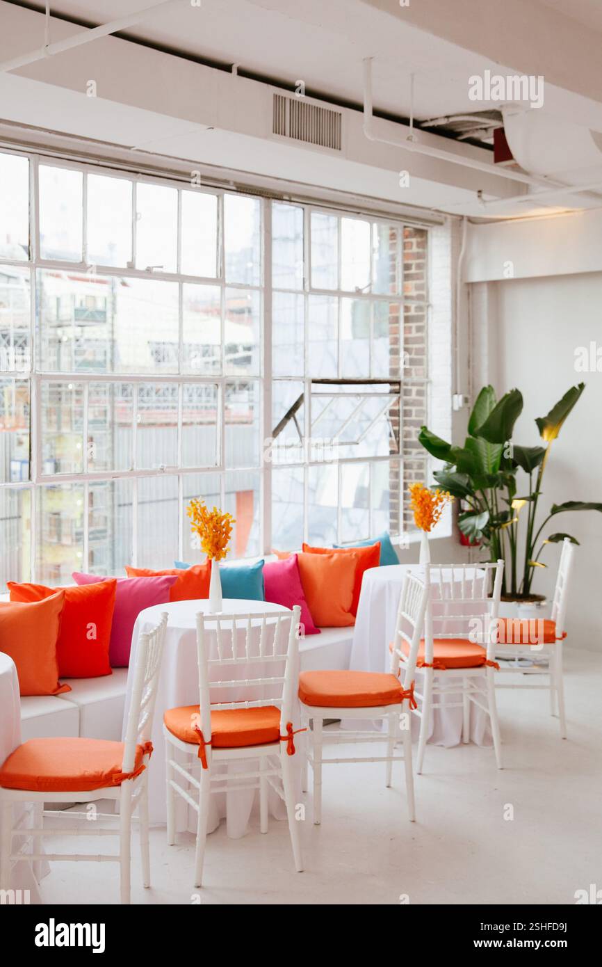 Colorful seating and decor brighten a stylish dining space filled with ...