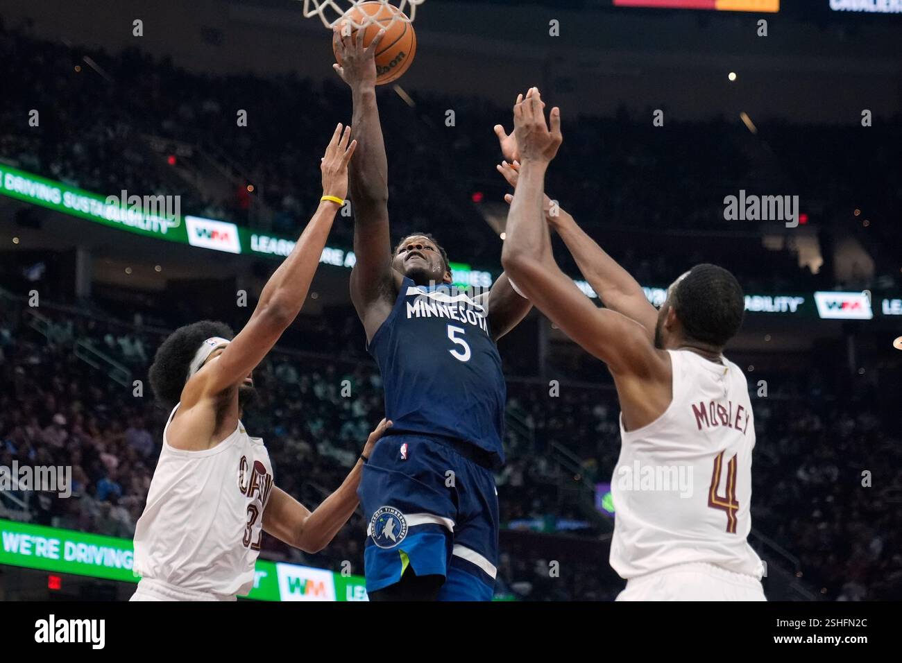 Minnesota Timberwolves guard Anthony Edwards (5) shoots between ...