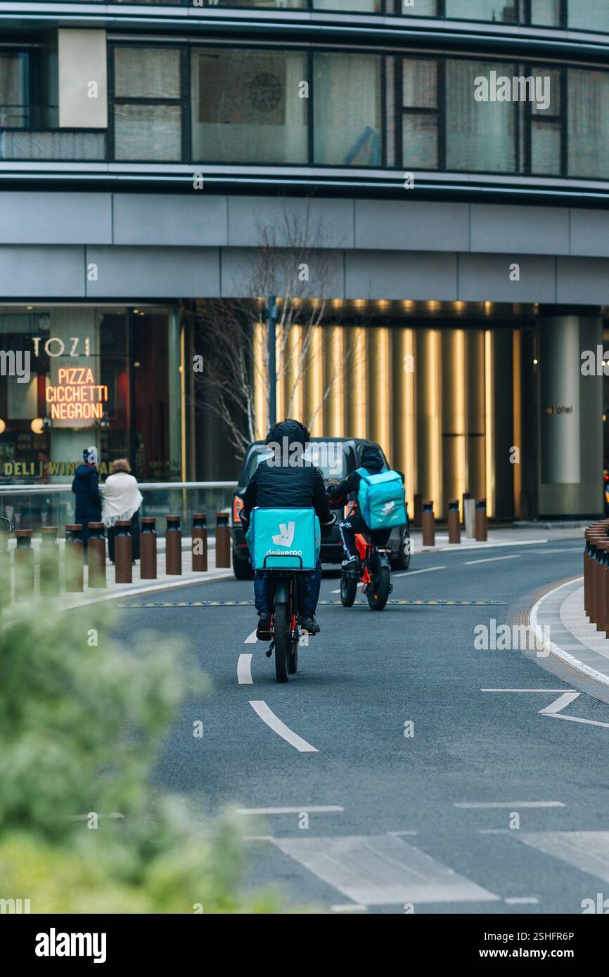 Two Deliveroo Cyclists on an Urban Road – Food Delivery Service in ...