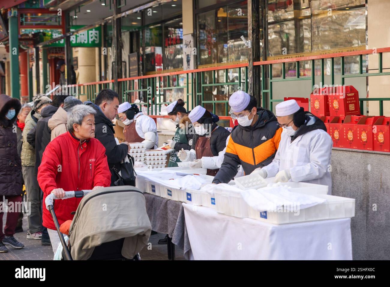 Beijing,China.10th February 2025. Residents buy Yuan Xiao, small ...