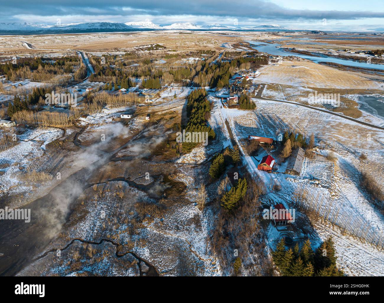 Aerial view of steam rising from geothermal pools at Laugarás in ...