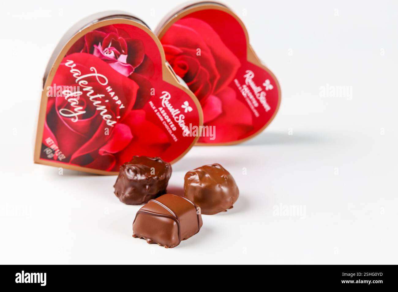 Heart-shaped chocolate boxes with assorted chocolates for Valentines ...