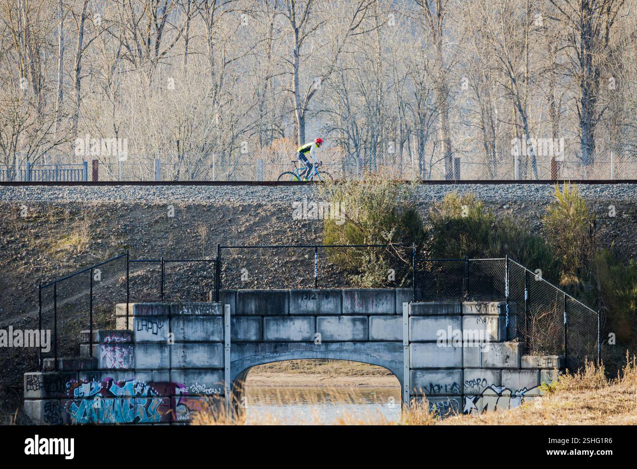 An unidentifiable person riding a bike on the Springwater Corridor ...