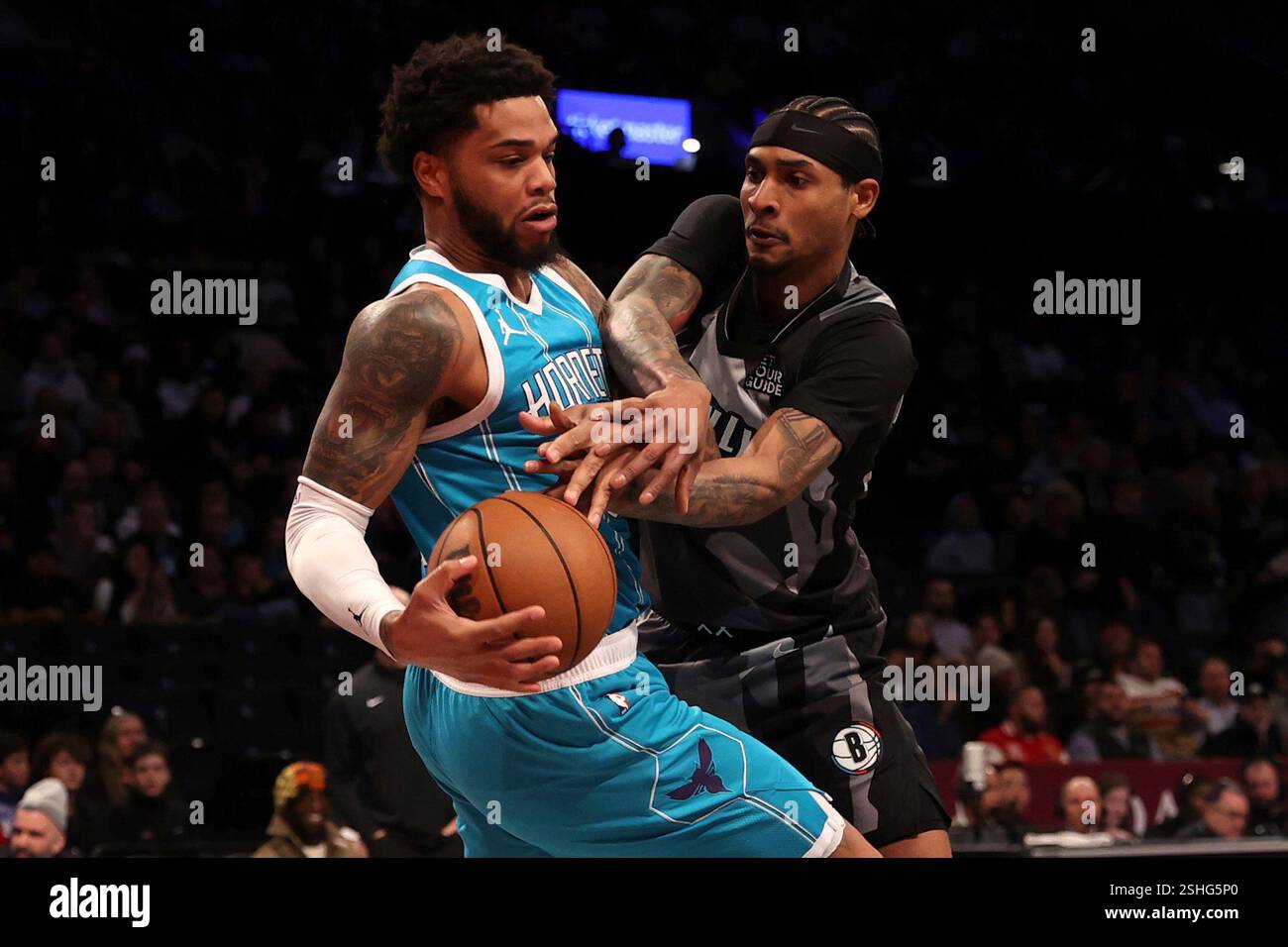 Brooklyn Nets' Keon Johnson, right, attempts to steal the ball from ...