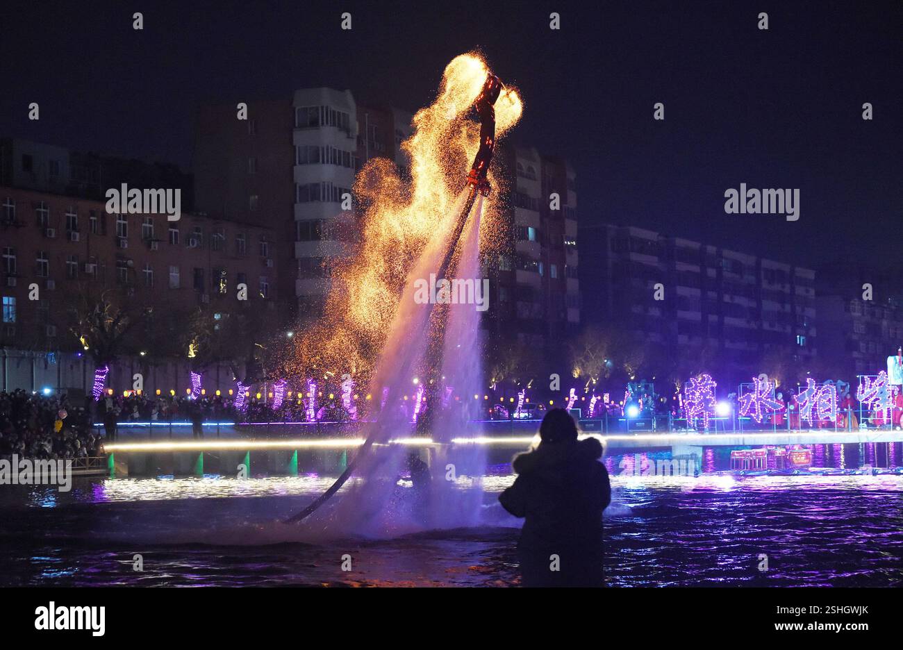 HANDAN, CHINA - FEBRUARY 10, 2025 - A water flying man performs a fire ...