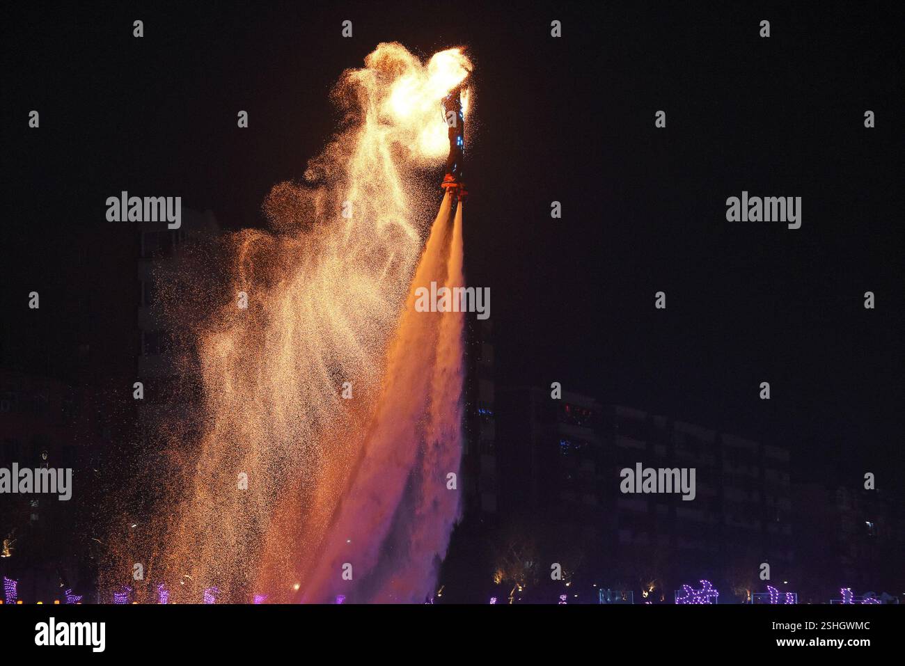HANDAN, CHINA - FEBRUARY 10, 2025 - A water flying man performs a fire ...