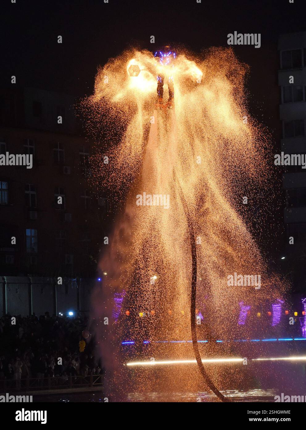 HANDAN, CHINA - FEBRUARY 10, 2025 - A water flying man performs a fire ...