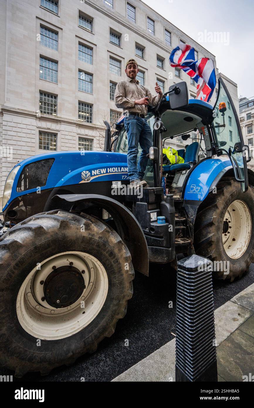 London, UK. 10th Feb, 2025. A farmer atop his tractor, having driven ...