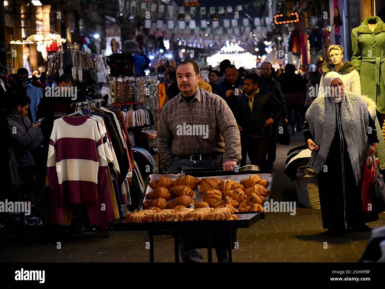 Damascus, Syria. 10th Feb, 2025. A pastry vendor is pictured at the ...