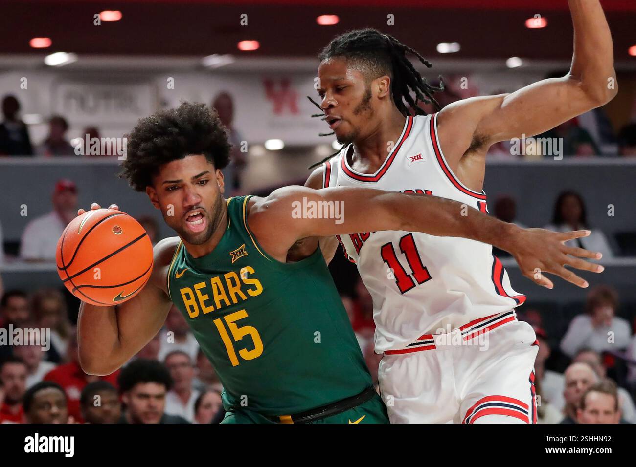 Baylor forward Norchad Omier (15) drives to the basket around Houston ...
