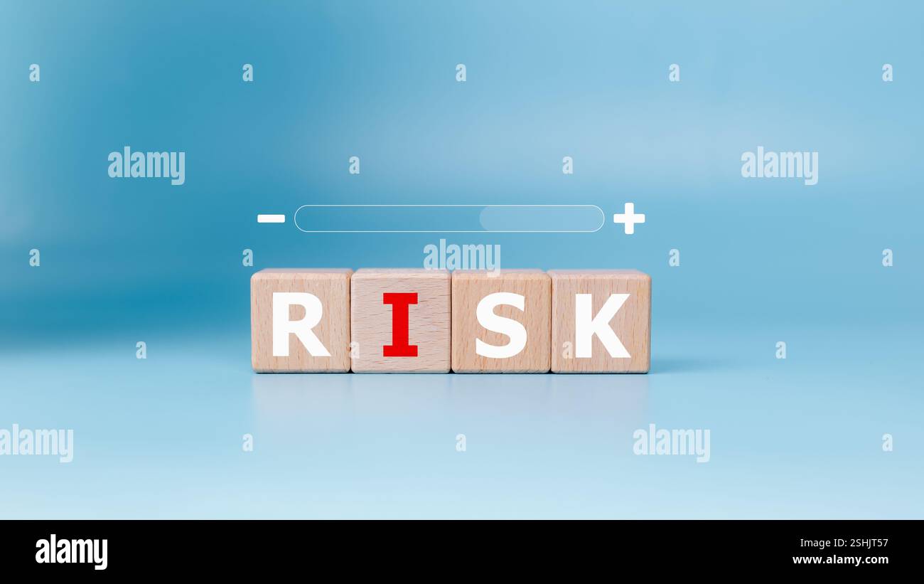 RISK management and set text at wooden blocks on light blue background ...
