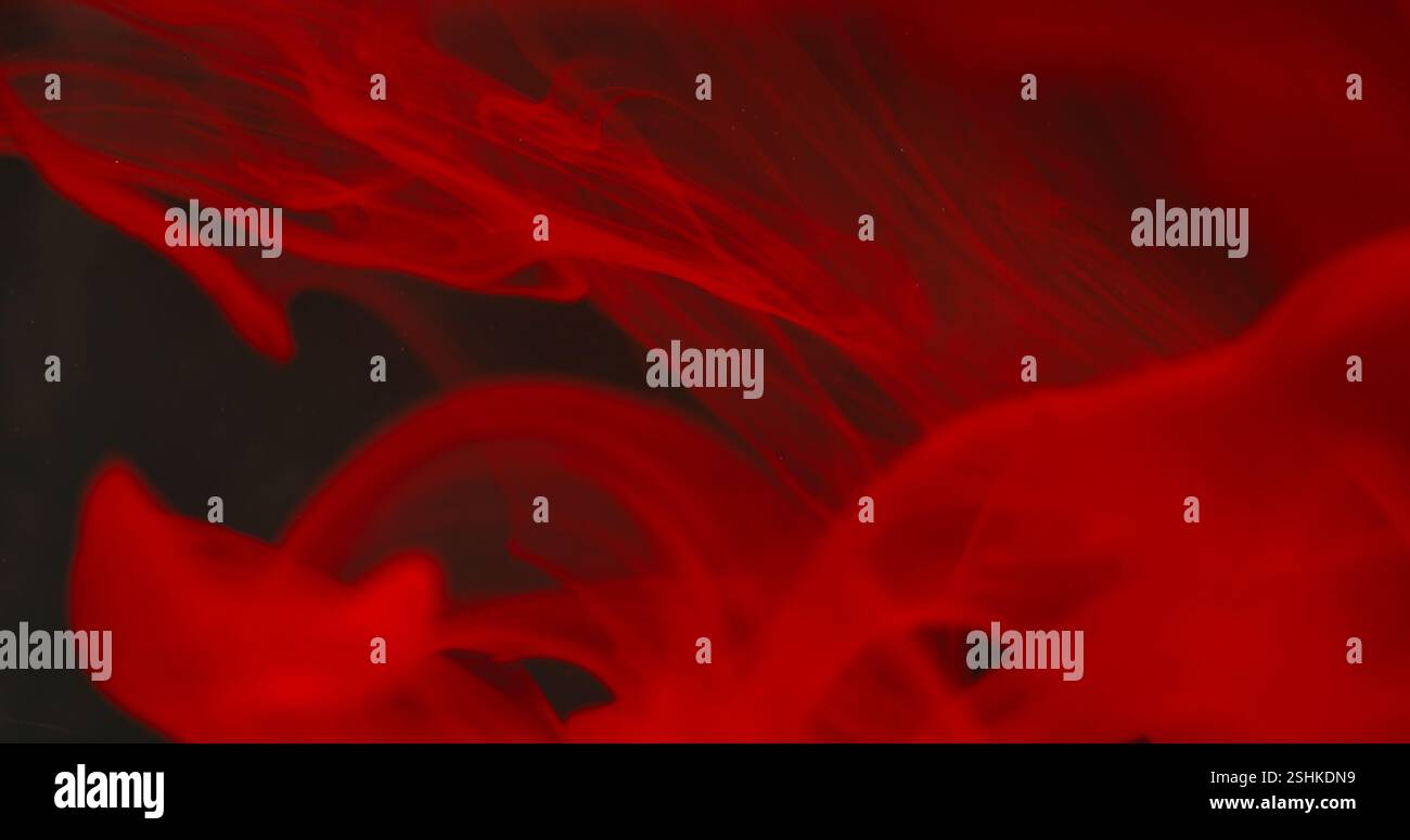 Ink water blowing. Blur smoke paint. Defocused red color glow liquid ...