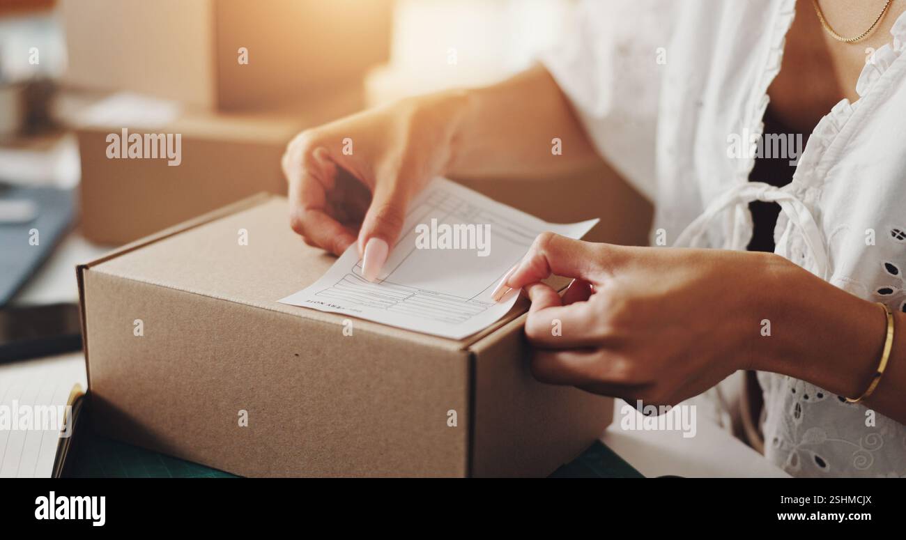 Hands, woman and box with label for distribution of online orders ...
