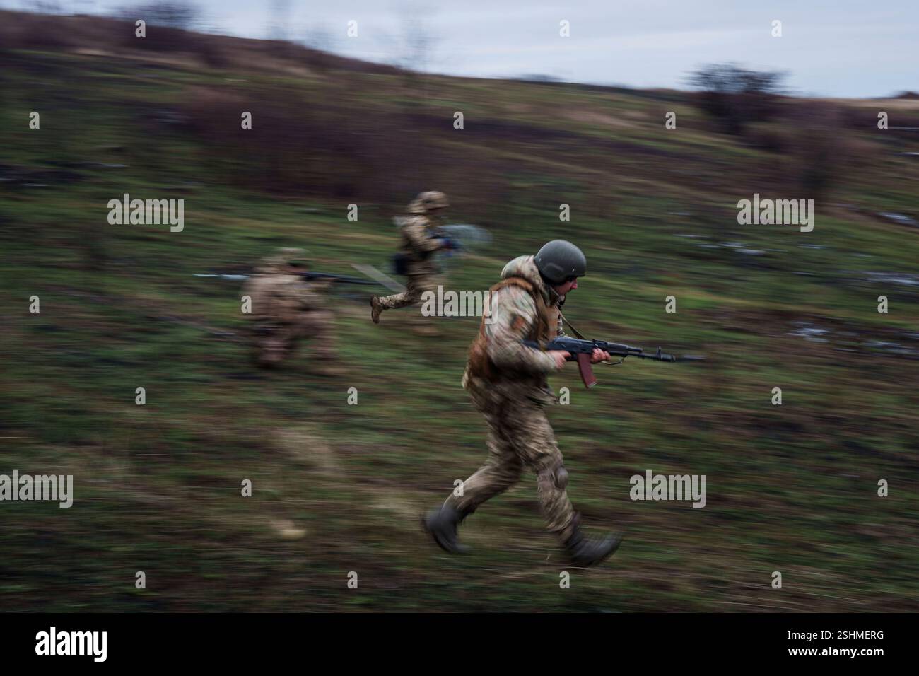 FILE - Ukrainian servicemen of 24th Mechanized Brigade train not far ...