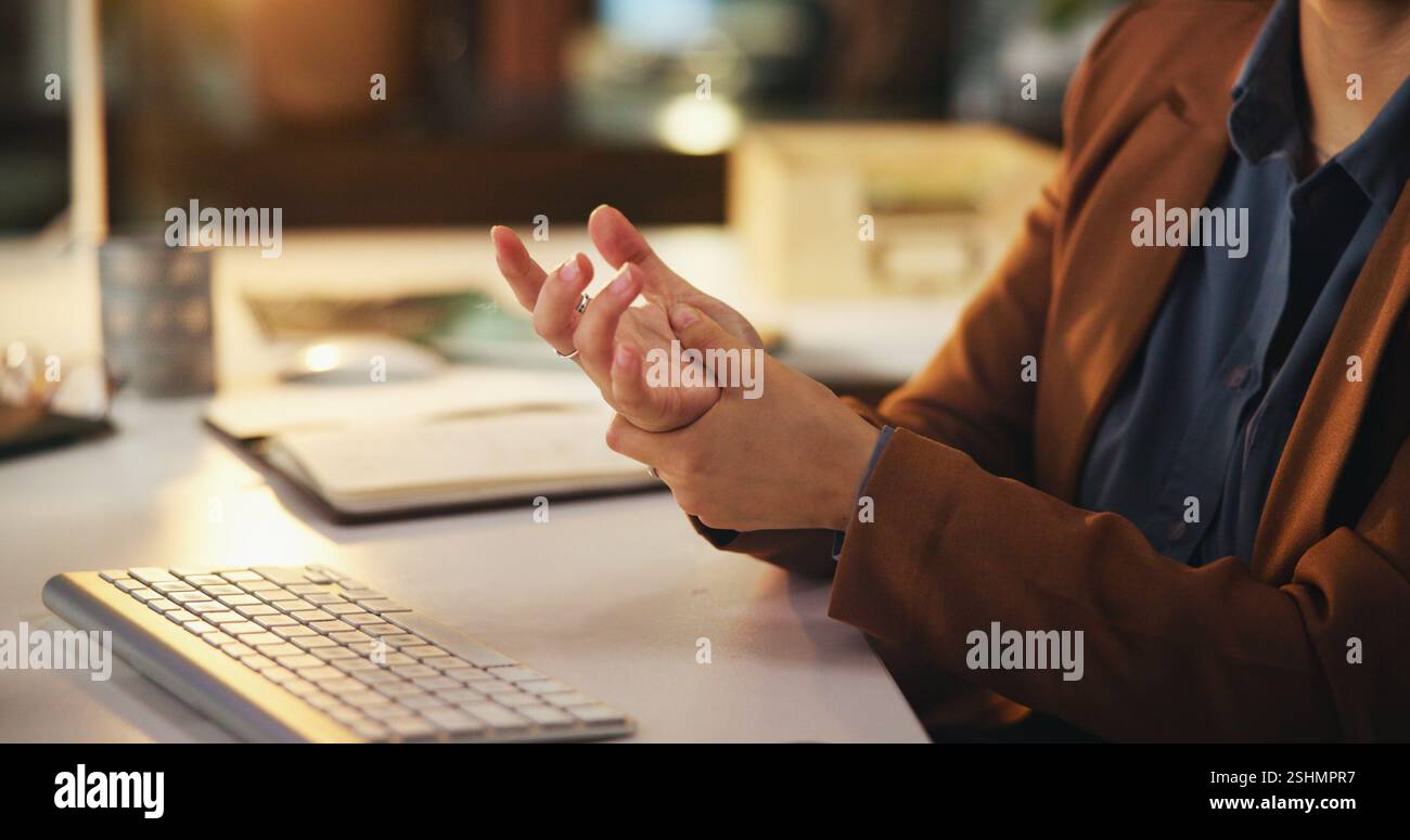 Night, woman and hands in office with joint pain, overworked muscle and ...