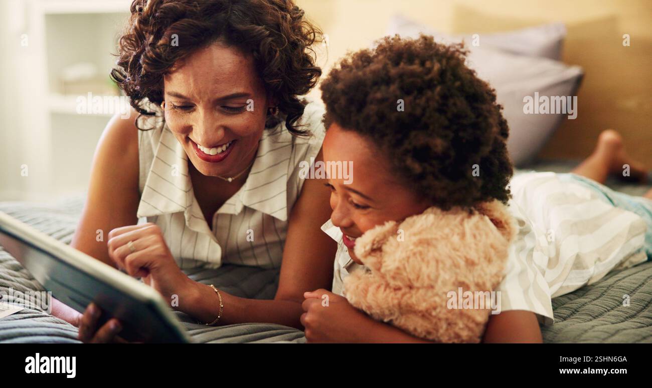 Woman, kid and relax on bed with tablet, streaming media or show ...