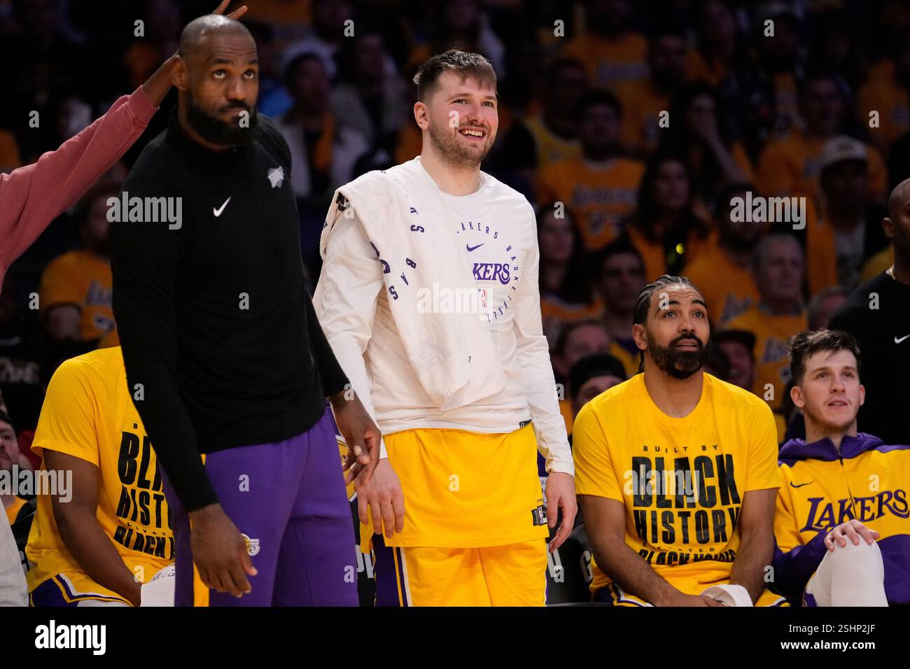 Los Angeles Lakers guard Luka Doncic, center, and teammate forward ...