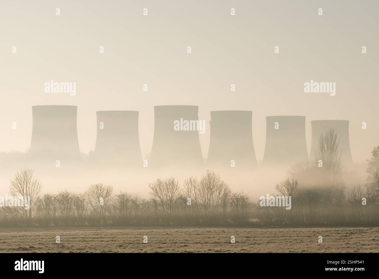 Distant power station in foggy weather Stock Photo - Alamy