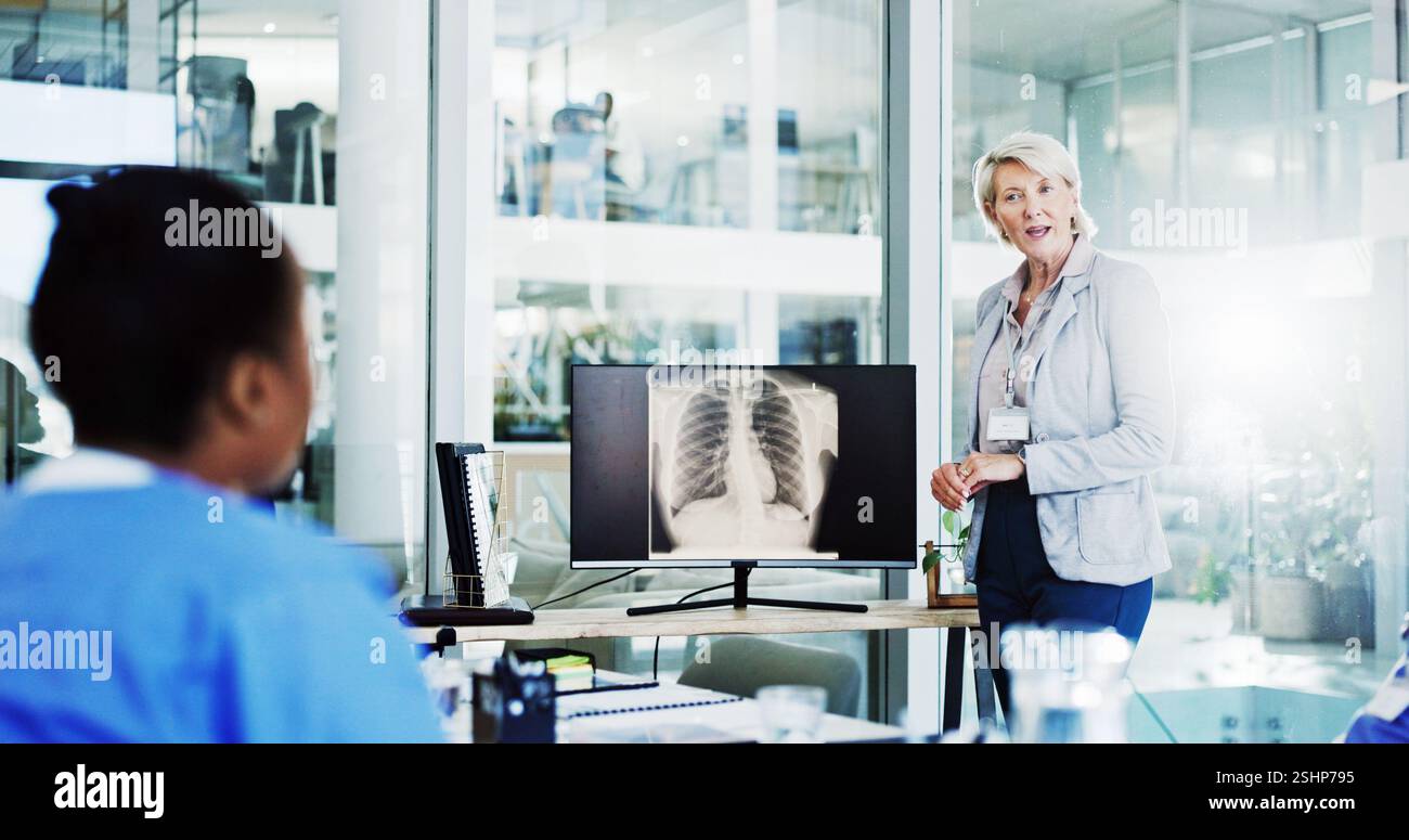 Doctor, surgeon and coaching with screen for x ray, medical procedure ...