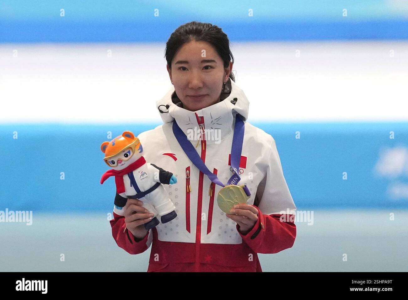 Gold medalist Han Mei, of China, celebrates on the podium during the ...