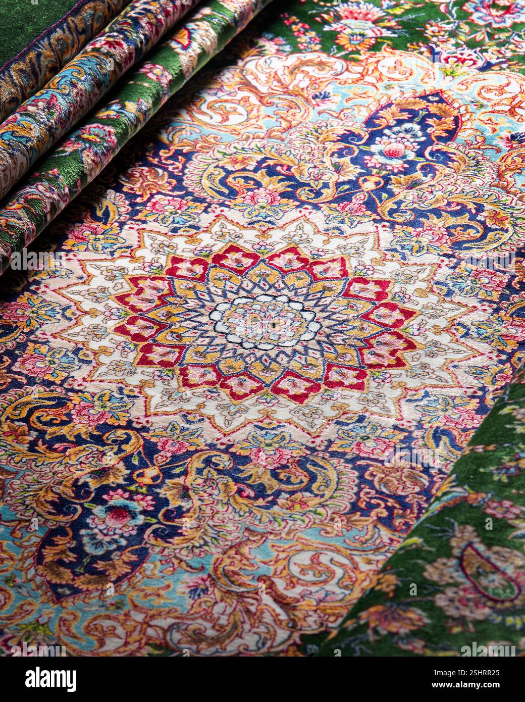 Exquisite Persian carpet with a symmetrical floral medallion design and ...