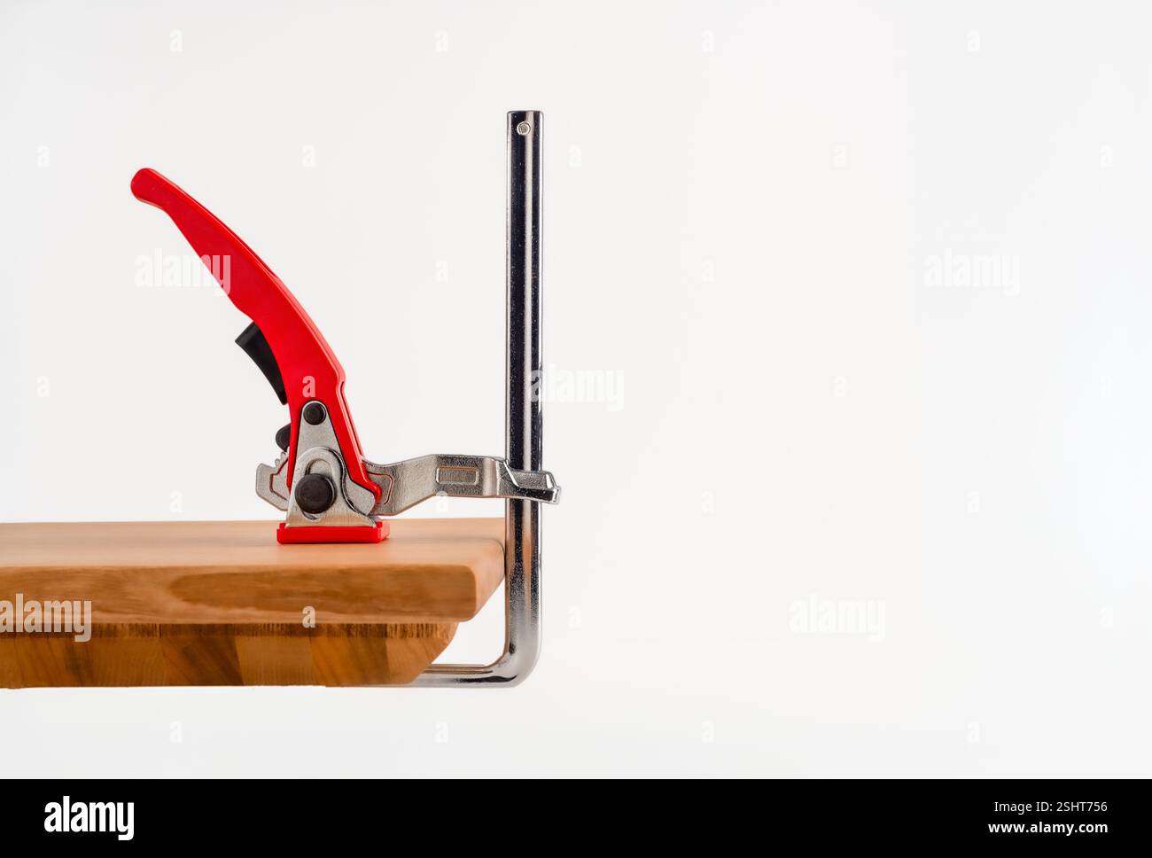 Quick release ratchet MFT table and track saw clamp isolated on a white ...