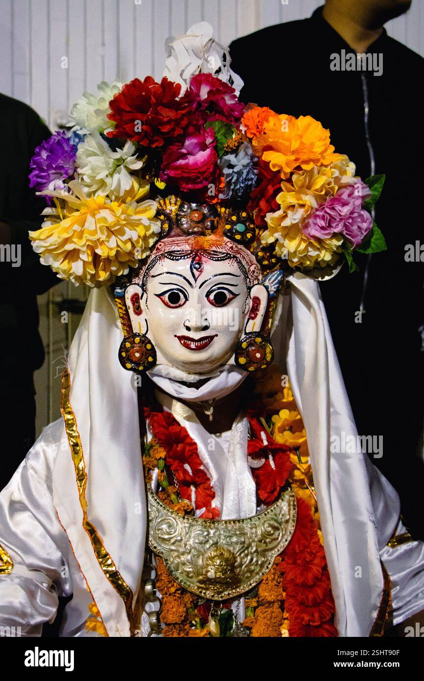 Rudrayani wears a white mask and attire when performing the ...