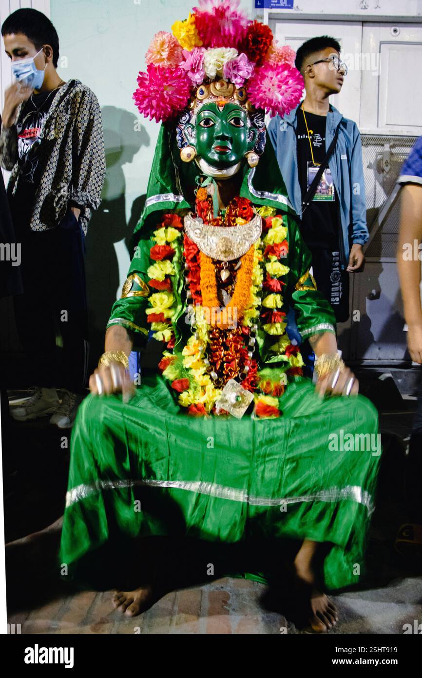 Vaishanavi wears a green mask and attire when performing the ...