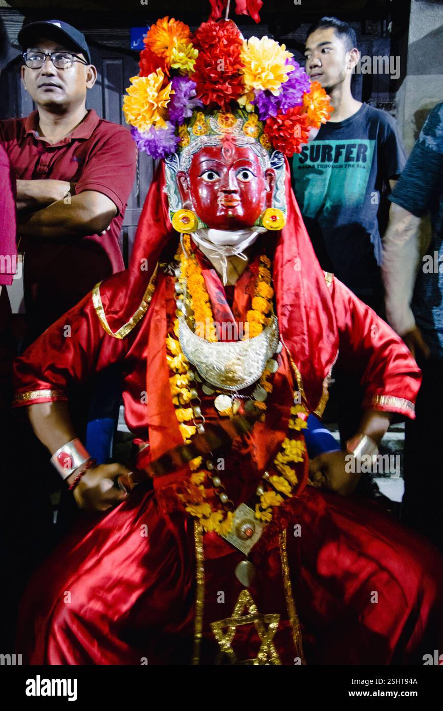 Kaumari, one of the Ashtamatrika Dancers wears a red mask and attire ...