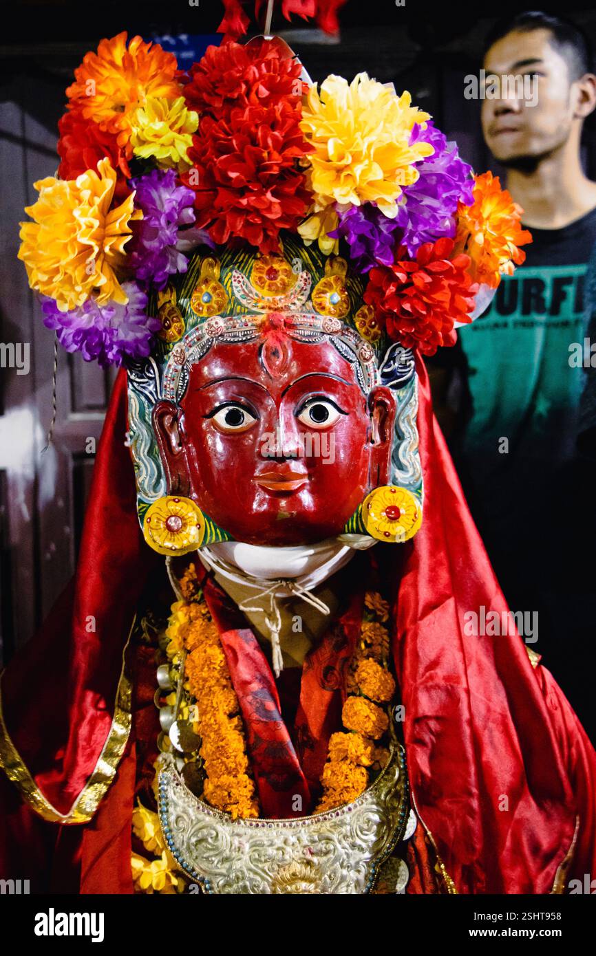 Kaumari, one of the Ashtamatrika Dancers wears a red mask and attire ...
