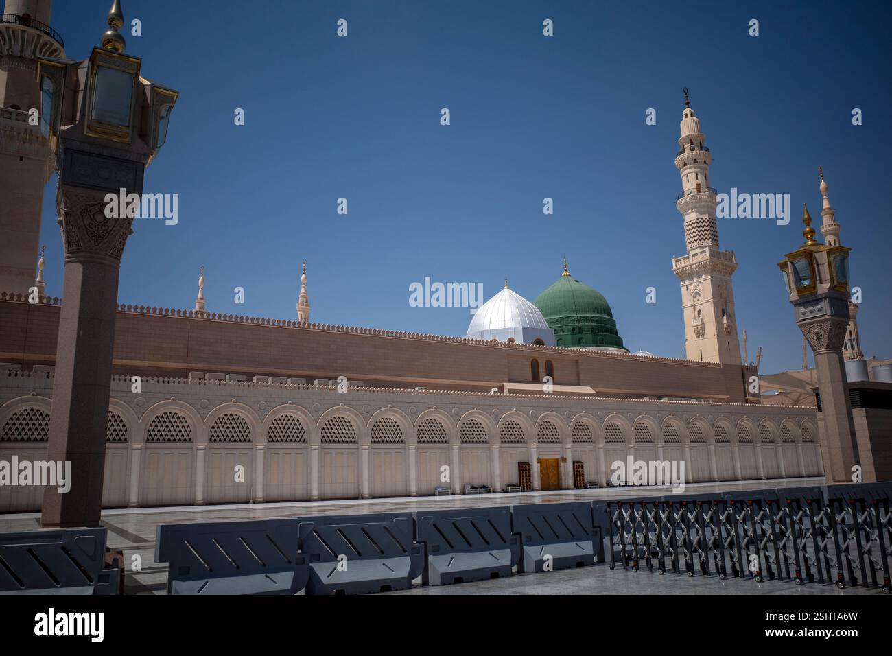 A green dome and minarets in Prophet Mosque in Madinah, also known as ...