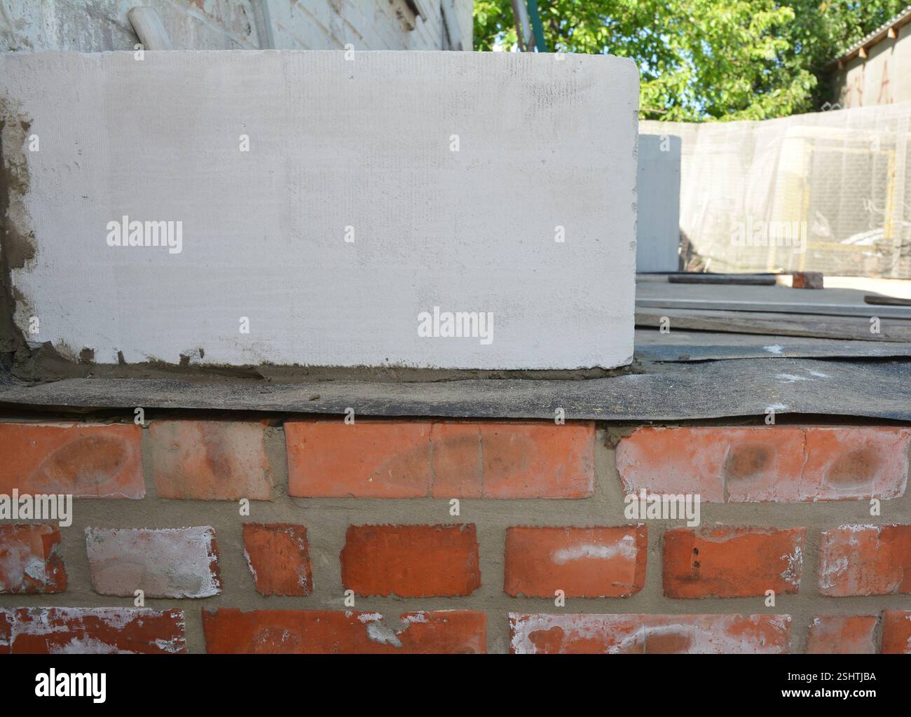 Foundation waterproofing close up. Bricklaying white autoclaved aerated ...