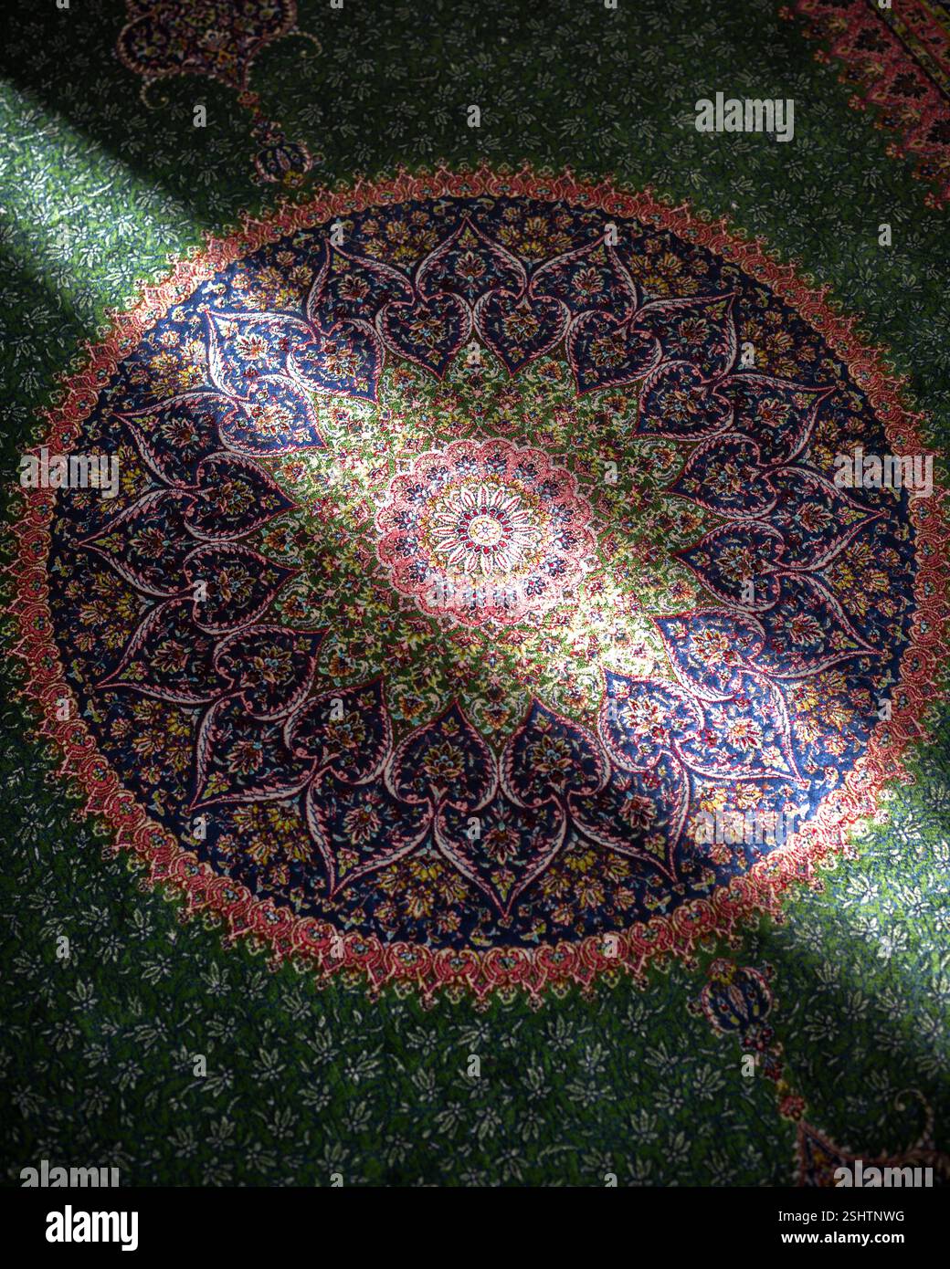 A circular Persian rug featuring an elaborate central medallion and ...