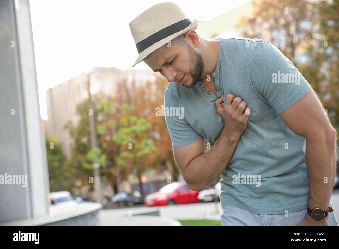 Man having heart attack on city street Stock Photo - Alamy