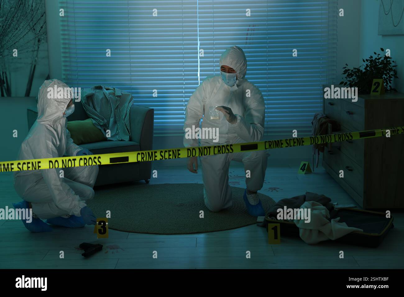 Forensic experts working at crime scene indoors Stock Photo - Alamy
